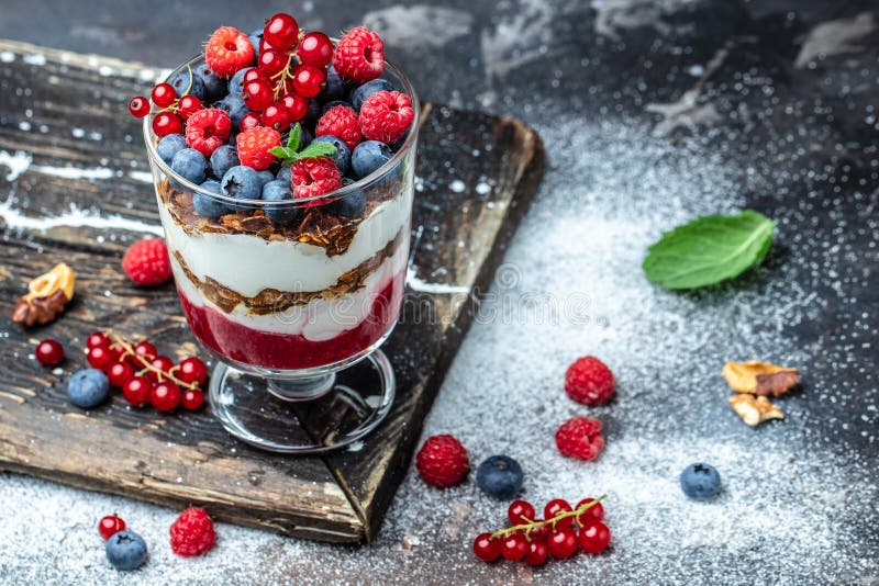Yogurt Granola Parfait with Blueberry and Raspberry on a Light ...