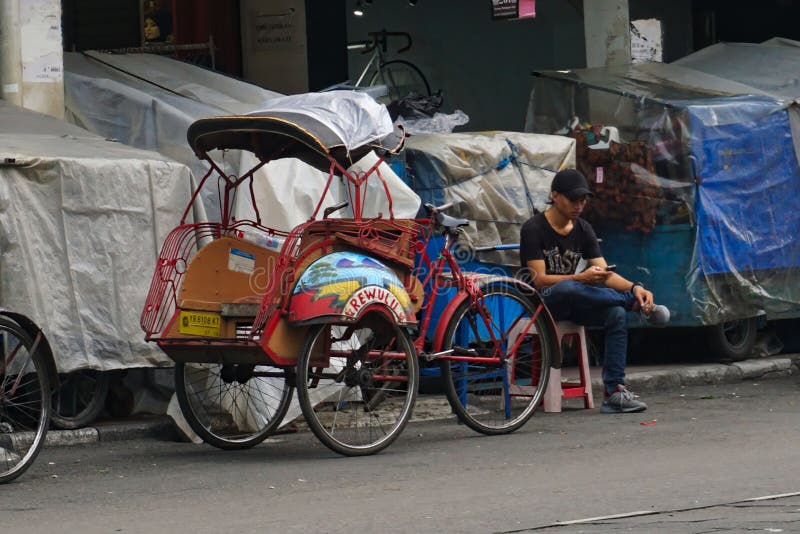 Yogyakarta, Java, Indonesia - March 6th 2018: Rickshaw Driver Waiting ...