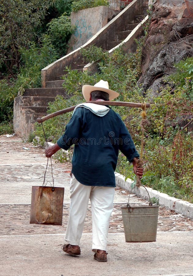 Yoking buckets of water stock image. Image of huraches - 405399