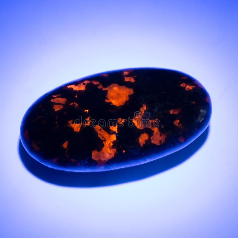 Yooperlite Specimen Showcasing Vibrant Orange and Red Inclusions within ...