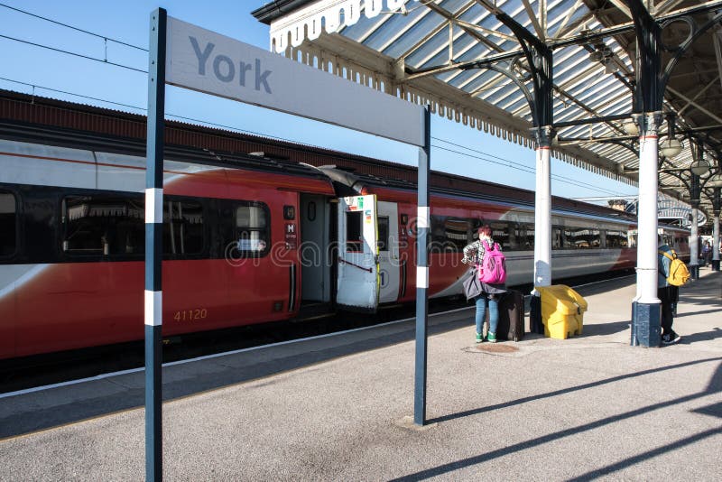 York Railway Platform with Sign and Train with Passengers Waiting To ...