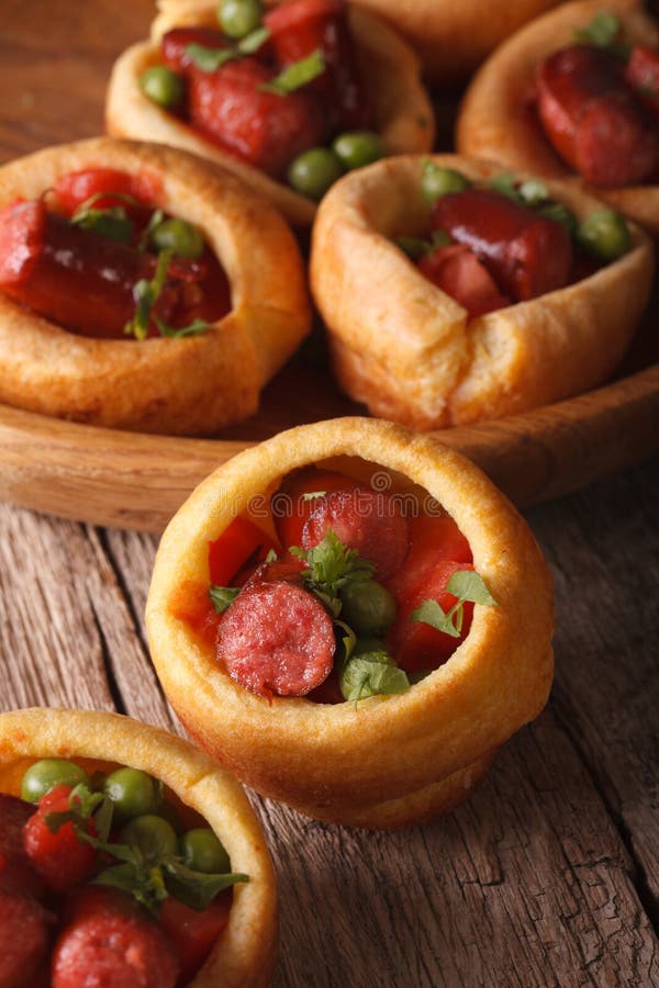 Yorkshire Puddings Stuffed with Sausages Close-up. Vertical Stock Image ...