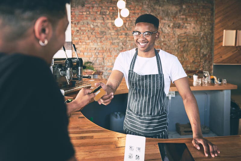 You Bring Your Card, we Bring the Coffee. a Man Using a Credit Card To ...