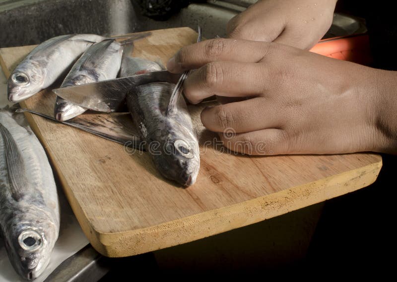 Raw Fish Being Cut before Cooked. Close Up Hand. Stock Image - Image of ...