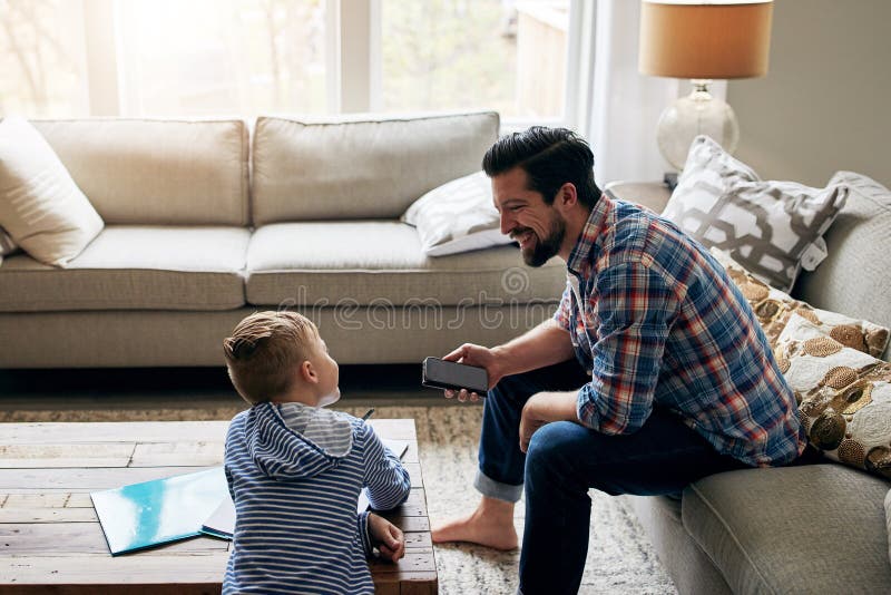 You really are Quite a Smart Little Kid. a Father Helping His Little ...