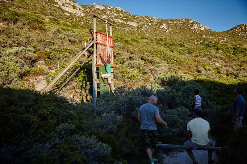 When You Reach a Wall, Climb it. a Group of Men Going through an ...