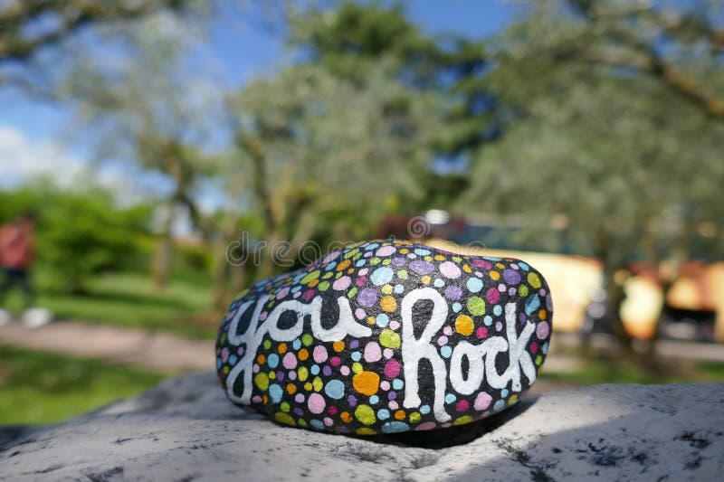 You Rock Encouraging Message Painted on Kindness Rock Held Up in Hand ...