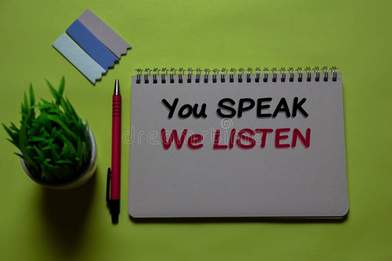 You Speak we Listen Write on a Book Isolated on Office Desk Stock Photo ...