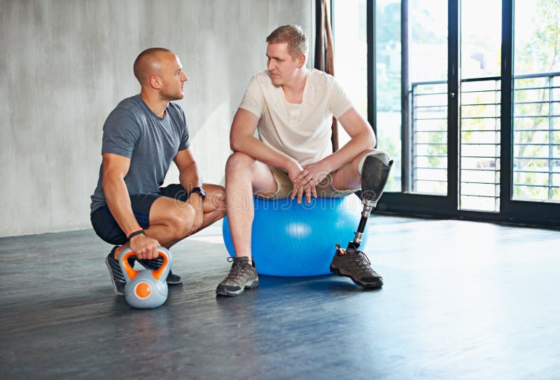 You Wanna Keep Going. Studio Shot of a Young Amputee Training in a Gym ...