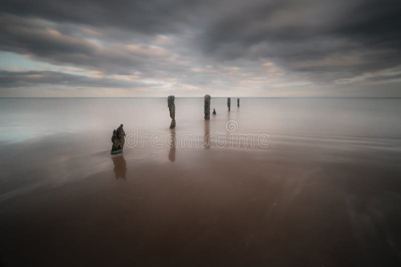 Youghal Strand Groynes stock photo. Image of sunset - 392955792