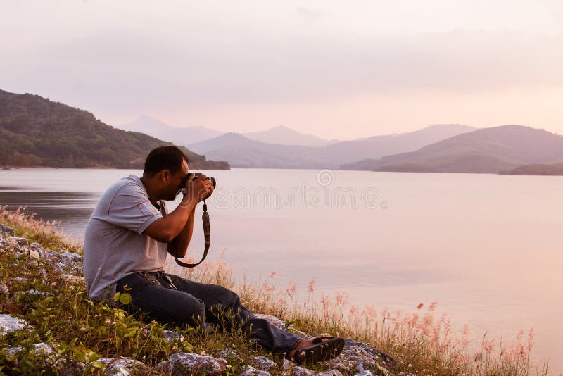 Yound man taking camera stock image. Image of face, outdoor - 68906911