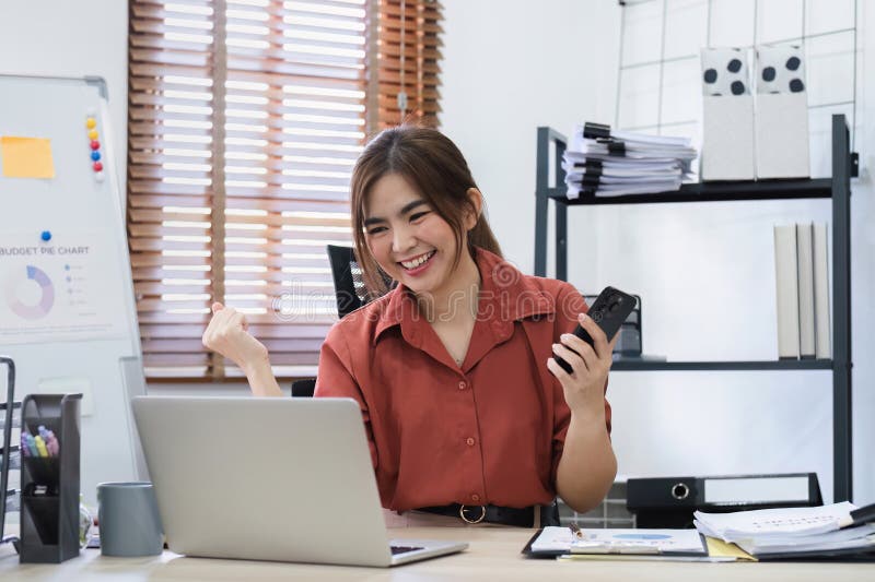 Young Accountant Using Telephone while Doing Paperwork in Modern Office ...