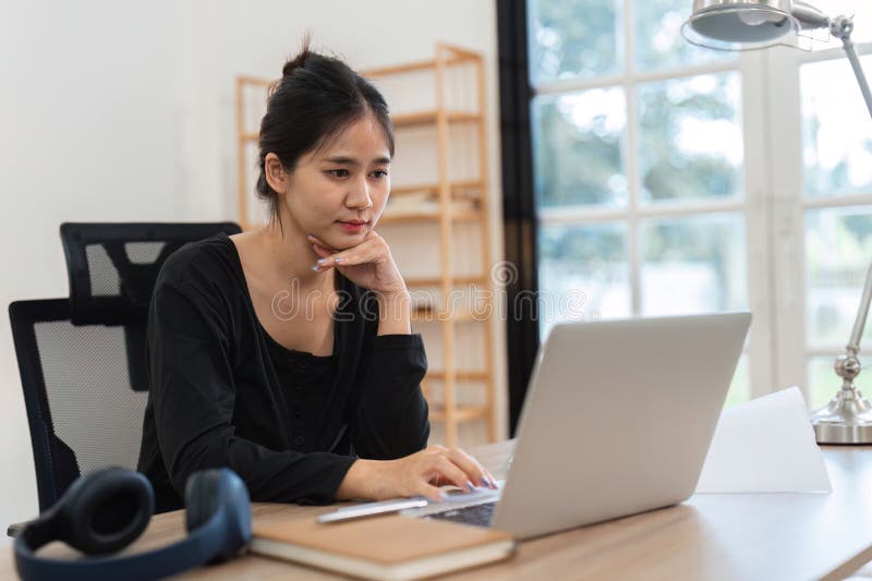 Young Accountant Working on Financial Documents at Home with Laptop in ...