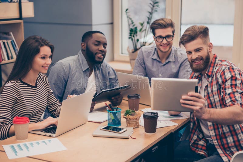 Young Active Diverse Team Working with a Business Project Stock Image ...