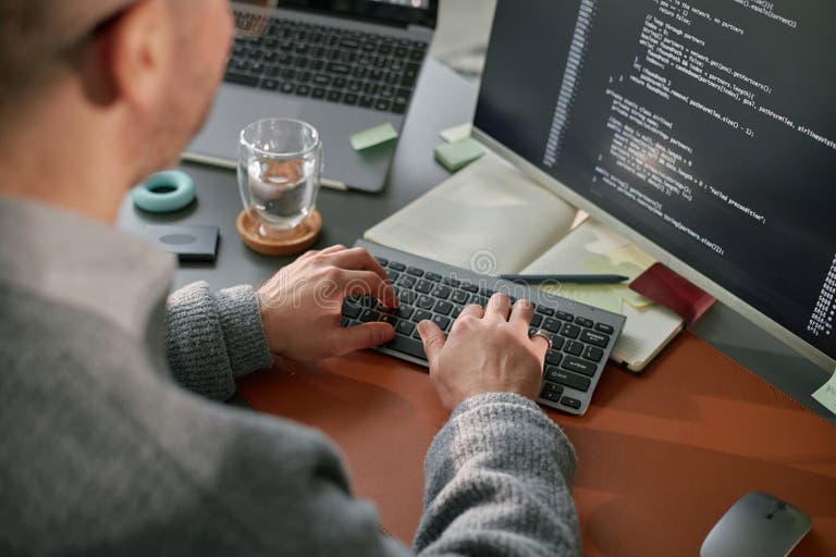 Young Adult Caucasian Man Coding Software on Computer in Modern Office ...