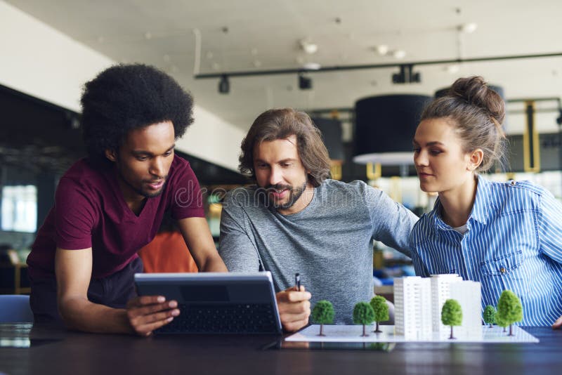 Young Adult Colleagues Working at Office Desk Stock Image - Image of ...