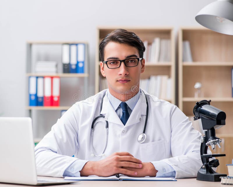 Young Adult Doctor with Laptop Computer Stock Image - Image of ...