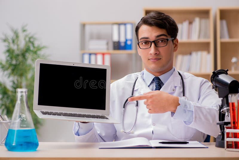 The Young Adult Doctor with Laptop Computer Stock Image - Image of ...