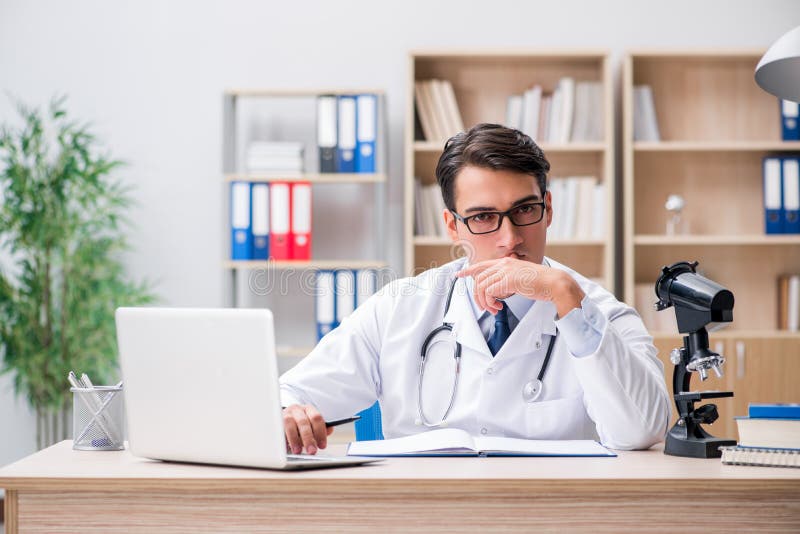 The Young Adult Doctor with Laptop Computer Stock Image - Image of ...