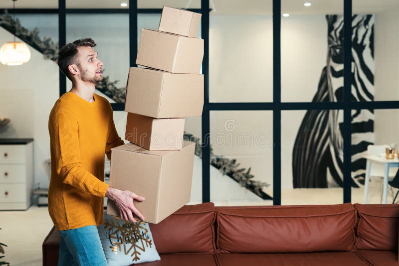 Young Adult Guy Move in New Flat, Dropping Boxes Stock Photo - Image of ...