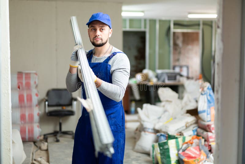 Worker Carrying Construction Materials at Renovating Object Stock Image ...