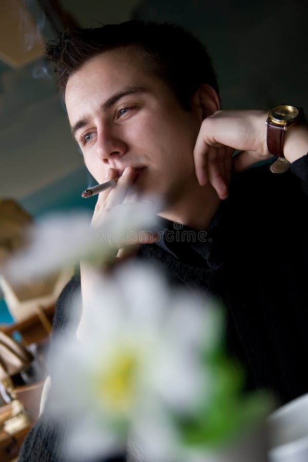 Young Adult Man Smoking in a Restaurant Stock Photo - Image of human ...