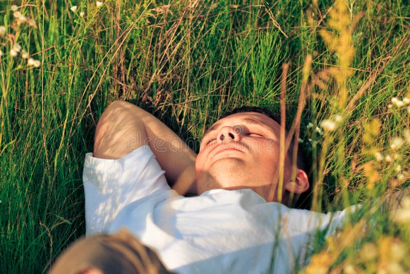 Young Adult Man in Spring Grass Stock Photo - Image of nature, leisure ...