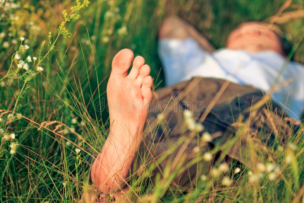 Young Adult Man in Spring Grass Stock Image - Image of sleep, meadow ...