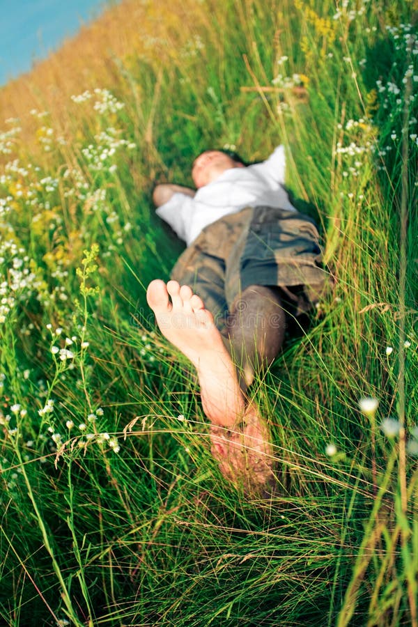 Man in the grass 2 stock photo. Image of seasonal, relaxed - 34788