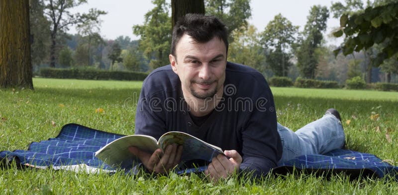 Young Adult Reading at the Park Stock Photo - Image of park, reading ...