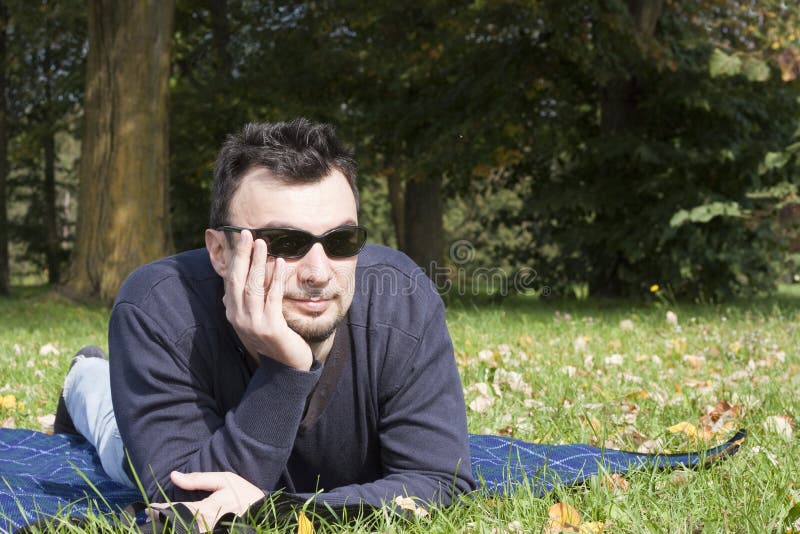 Young Adult Relaxing in the Park Stock Photo - Image of relaxing ...