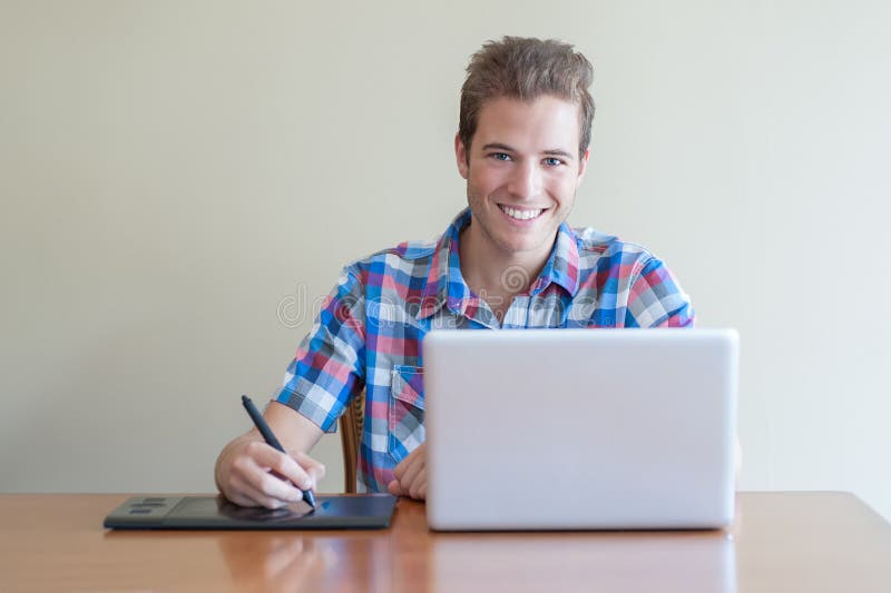 Young Adult Using Computer and Touch Input Tablet Stock Photo - Image ...