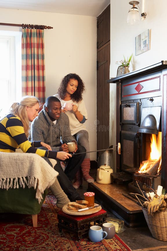Young Adults Making Toast on Open Fire Stock Photo - Image of fall ...