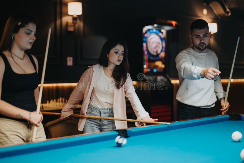 Excited Young Woman Playing Billiards with Friends in a Fun Atmosphere ...