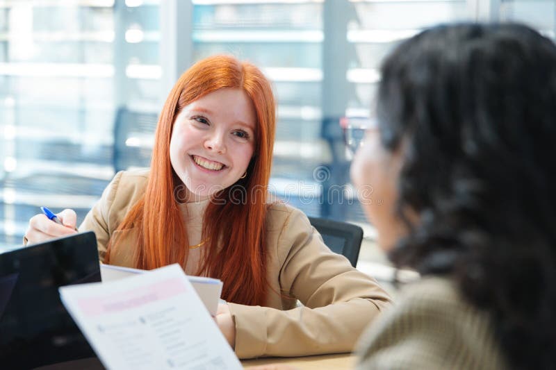 Young Adults Working Together on a Collaborative Business Project in a ...