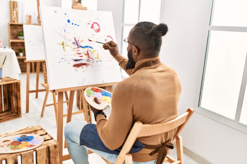 Young African American Artist Man on Back View Drawing at Art Studio ...