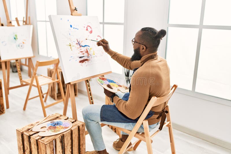 Young African American Artist Man on Back View Drawing at Art Studio ...