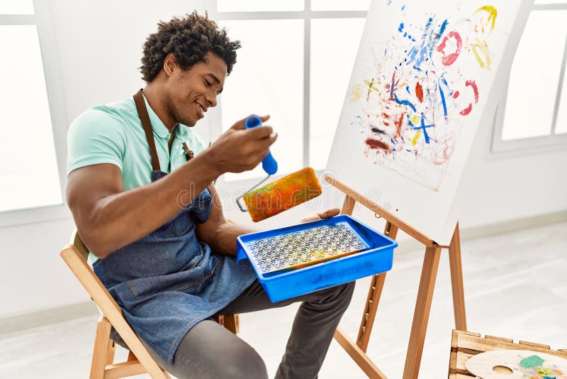 Young African American Artist Man Drawing Using Paint Roller at Art ...