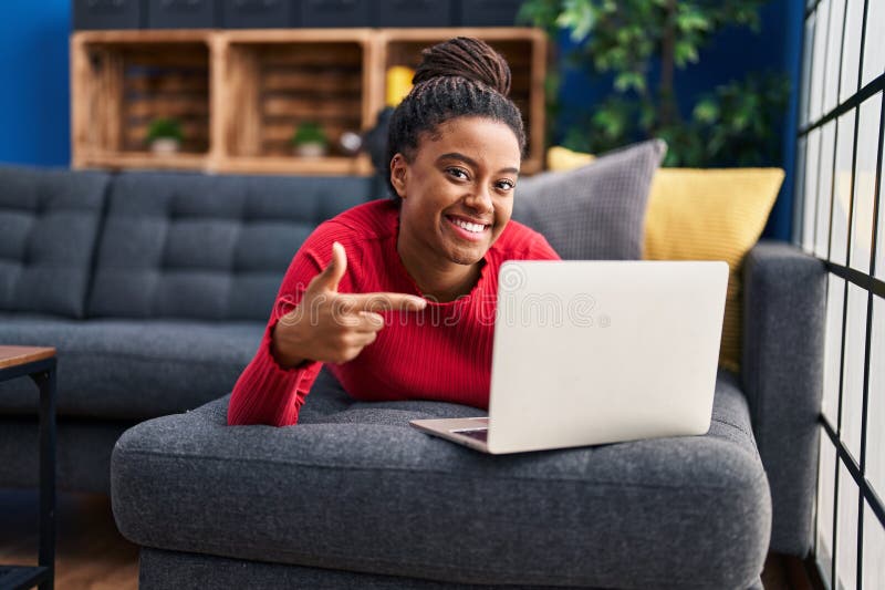 Young African American with Braids Working Using Computer Laptop ...