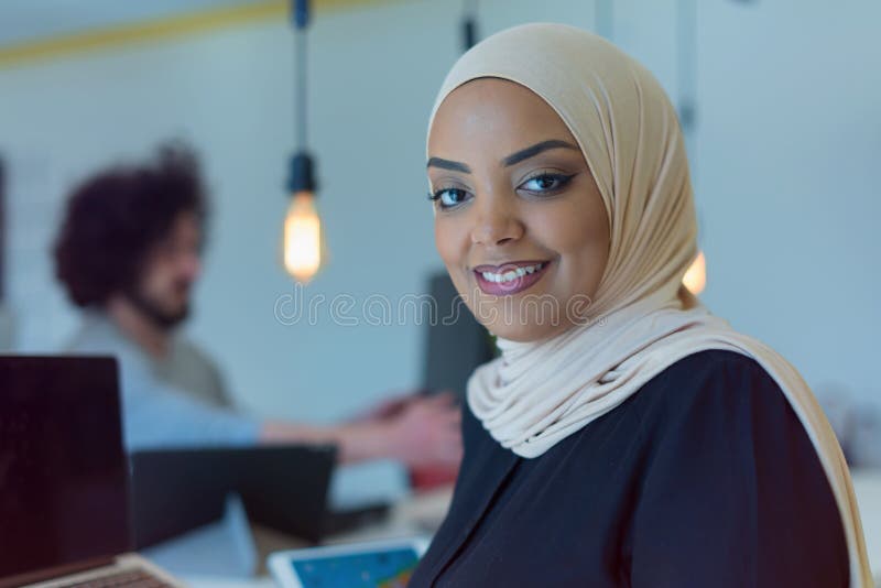 Happy Successful Business Leader Posing while Her Team in Background ... Happy Successful Business Leader Posing while Her Team in Background ...