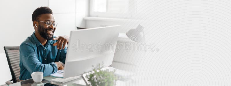 Young African American Businessman Working on His Computer in a Modern ...