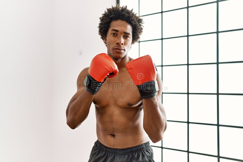 Young African American Man Training Using Dumbbells at Gym Stock Photo ...