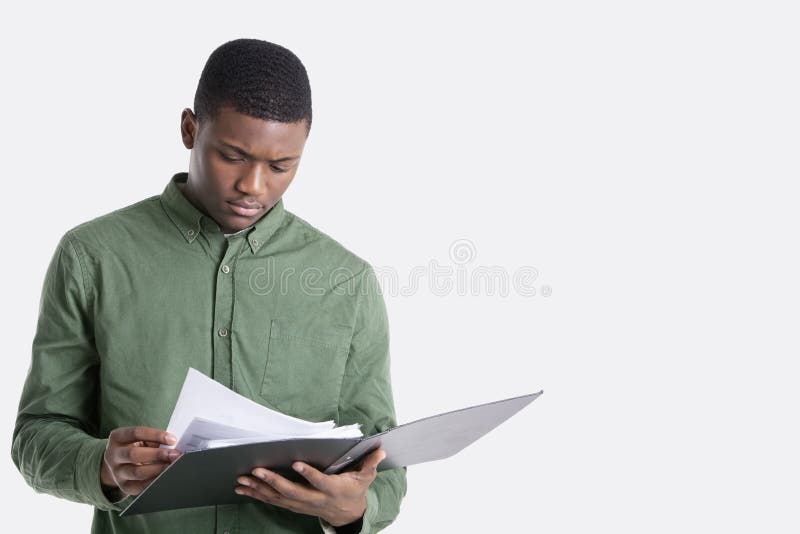 Portrait of a Young African American Man Standing with Legs Crossed ...