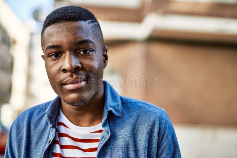 Young African American Man with Relaxed Expression Standing at the City ...