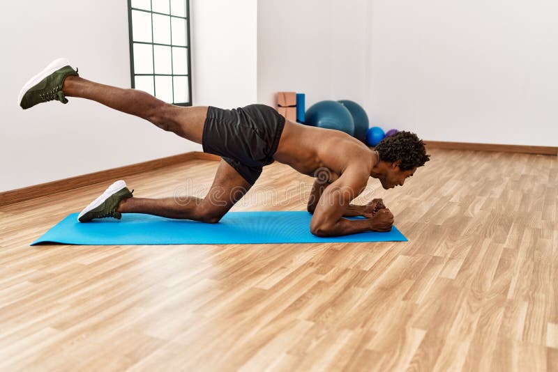 Young African American Man Training Abs Exercise at Gym Stock Image ...