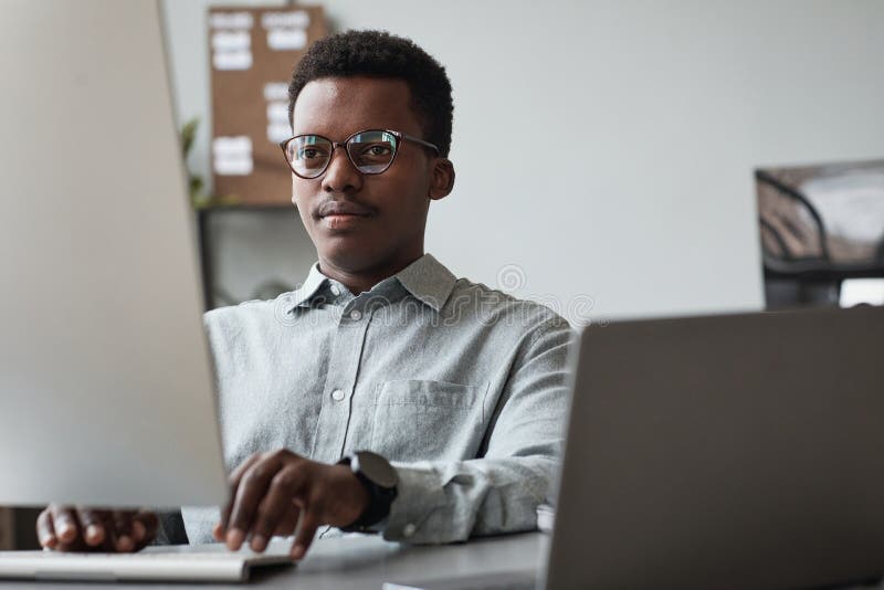 Young African American Man Using Computer at Work Stock Image - Image ...