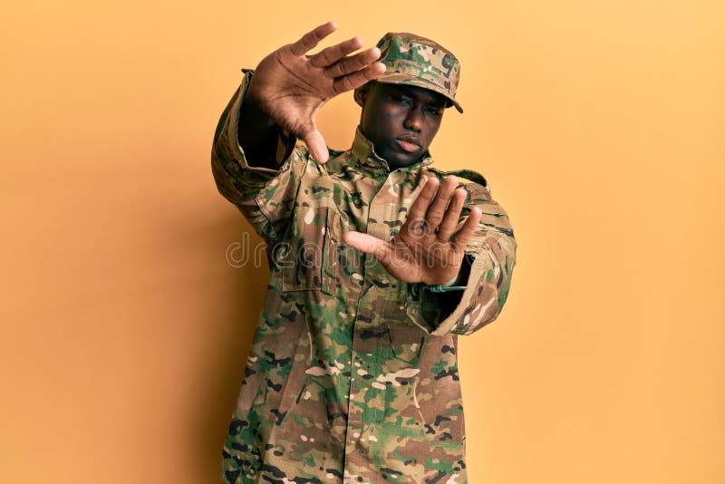 Young African American Man Wearing Army Uniform Doing Frame Using Hands ...