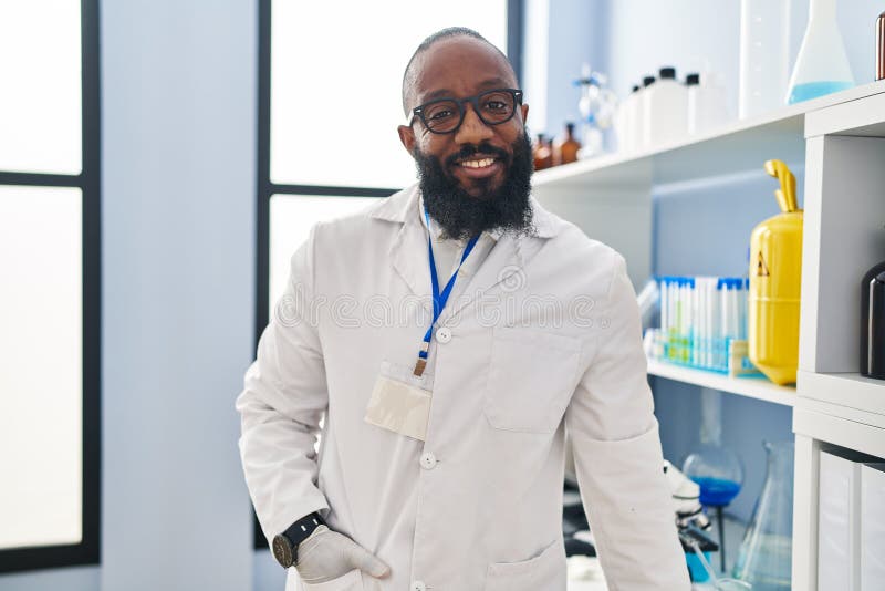 Young African American Man Wearing Scientist Uniform Standing at ...
