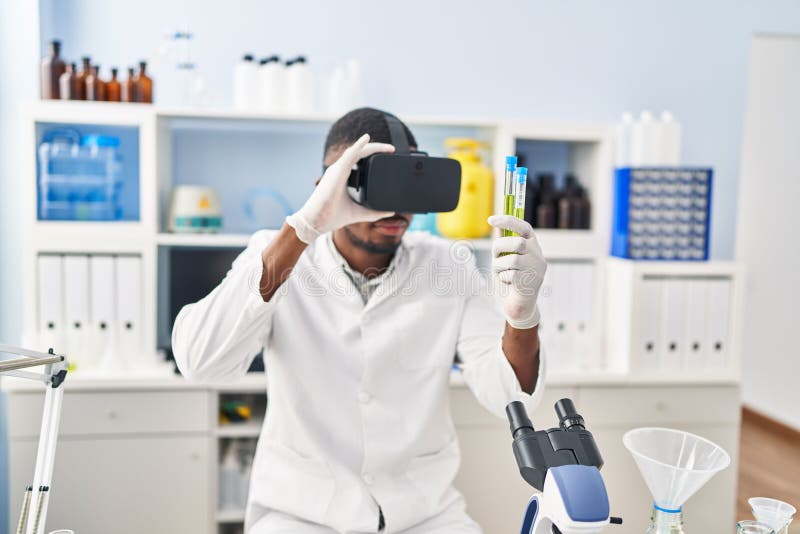 Young African American Man Wearing Scientist Uniform Using Virtual ...