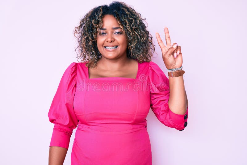 Young African American Plus Size Woman Wearing Casual Clothes Smiling